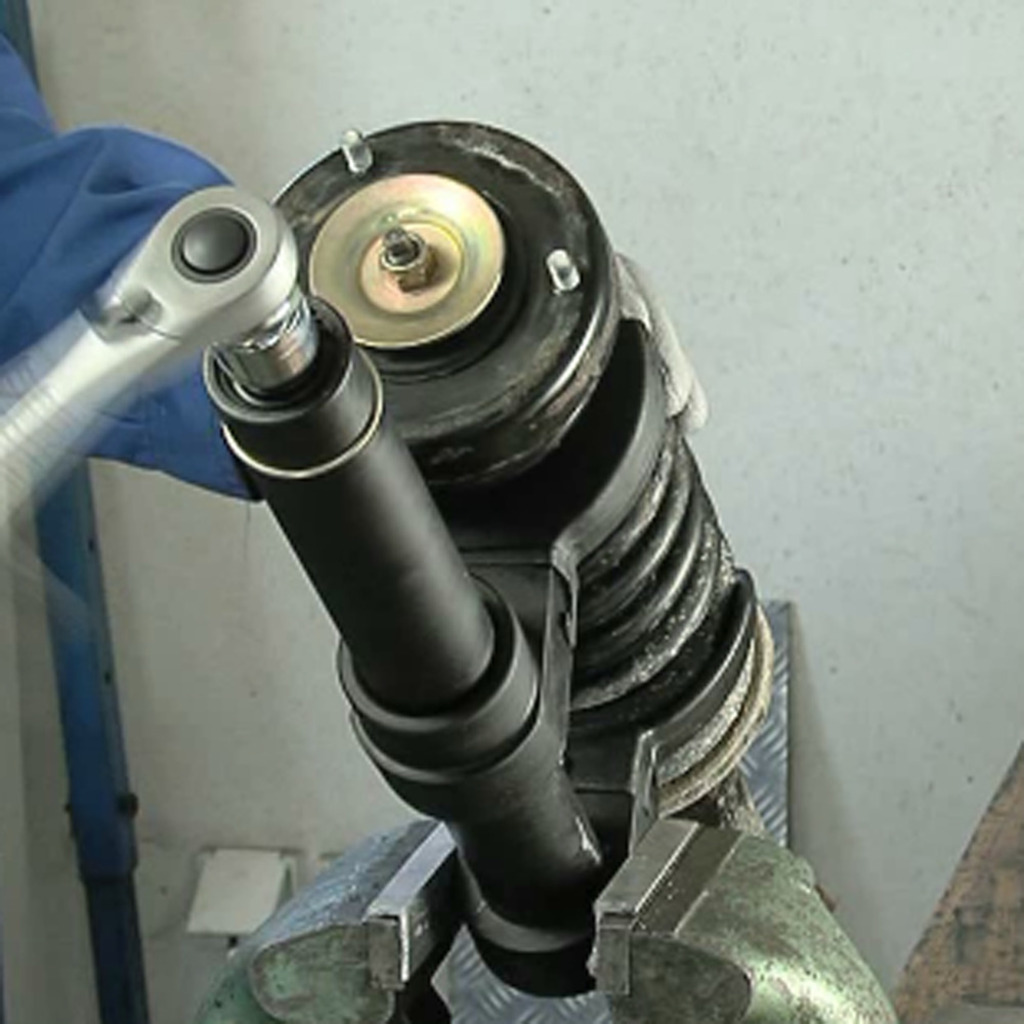 Suspension compressor for shock absorber springs