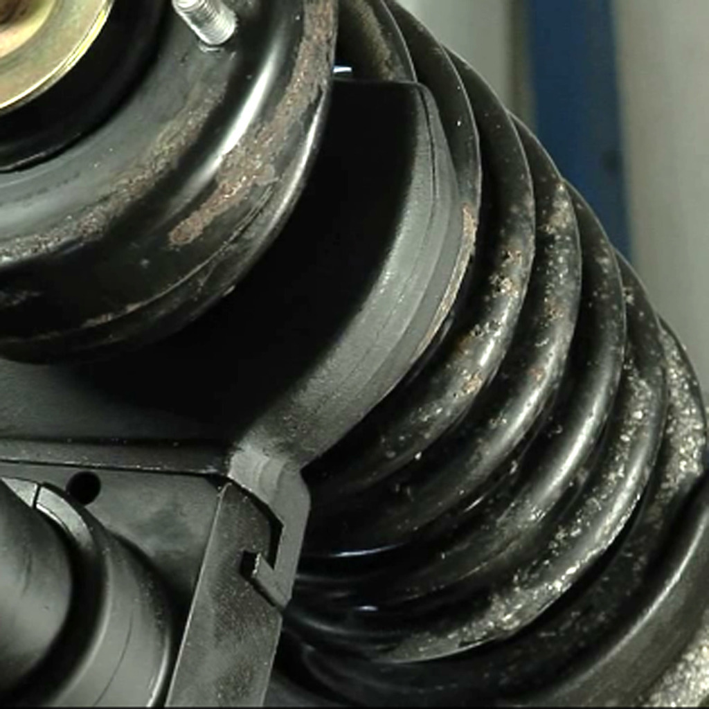 Suspension compressor for shock absorber springs